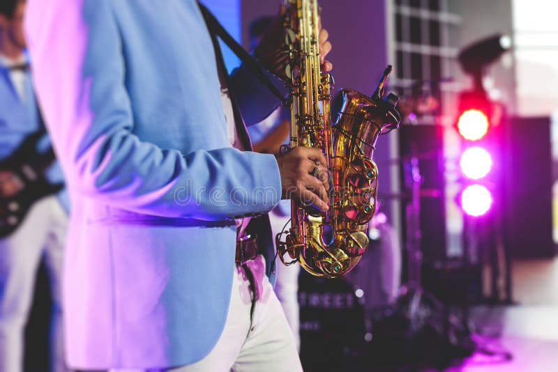 Concert View of Saxophonist, a Saxophone Sax Player with Vocalist and ... Concert View of Saxophonist, a Saxophone Sax Player with Vocalist and ...
