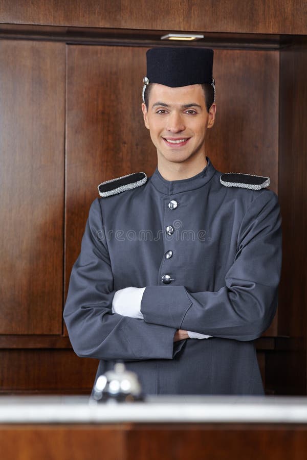 Concierge Behind Hotel Reception Counter Stock Image - Image of hands ...