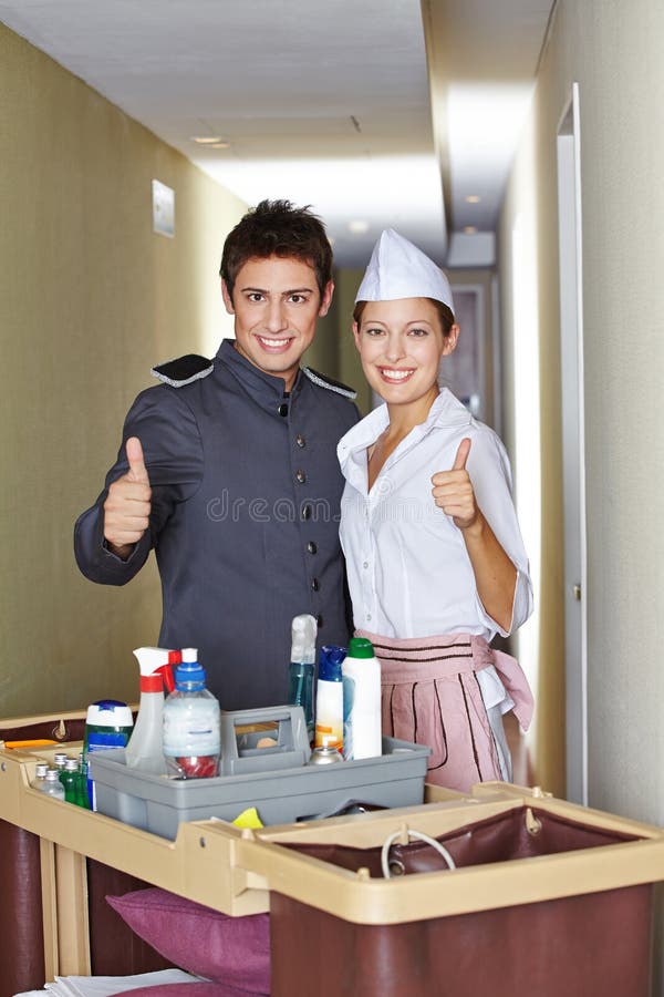 Concierge and Hotel Maid Holding Thumbs Up Stock Photo - Image of lady ...