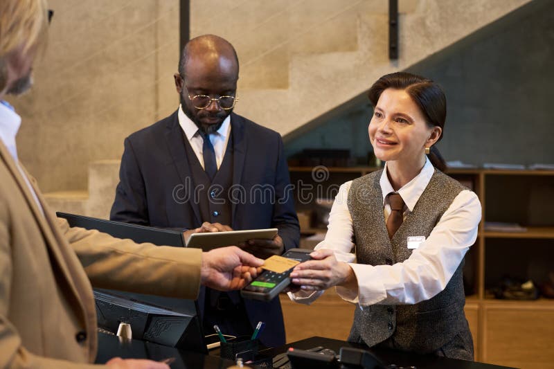 Concierge Processing Payment at Hotel Front Desk Stock Image - Image of ...