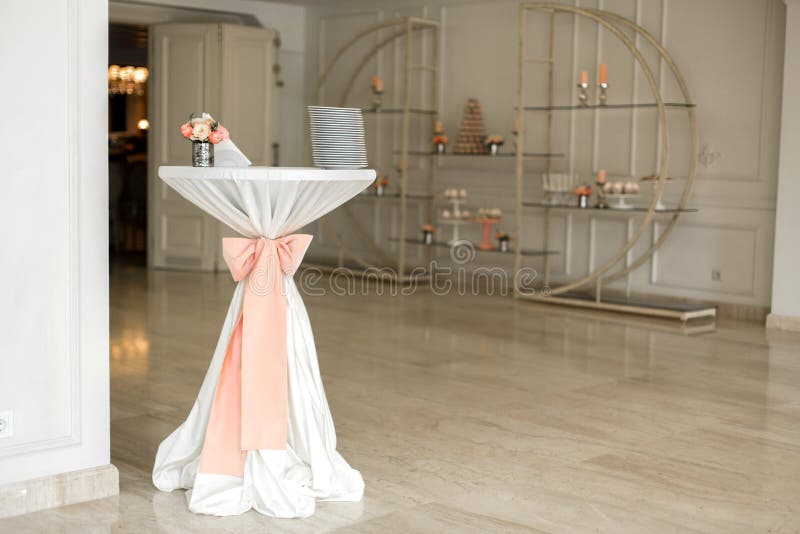 Concierge Table for a Wedding Ceremony, Decorated with Pink Fabric ...
