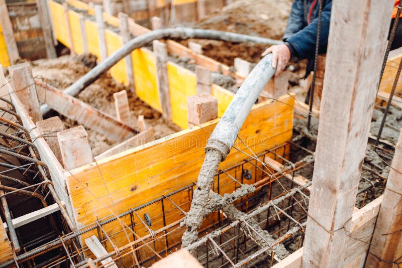 Concrete Automatic Pump Working and Pouring Cement into Wooden Frames ...