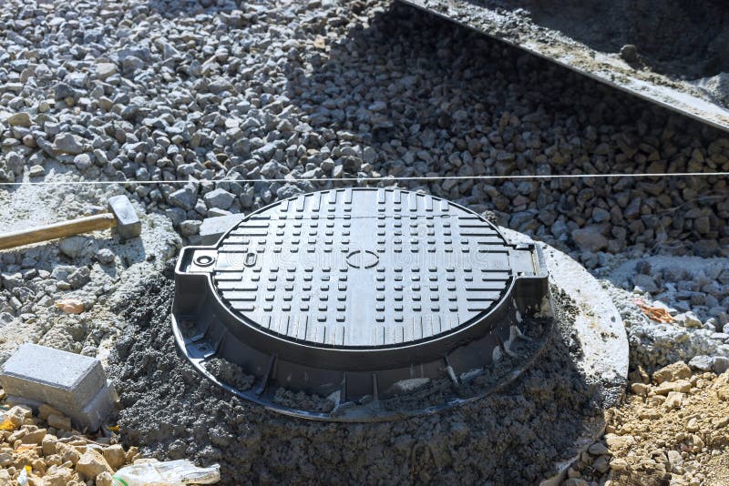 Concrete is Being Placed To Secure Forming Top Border of a Manhole for ...