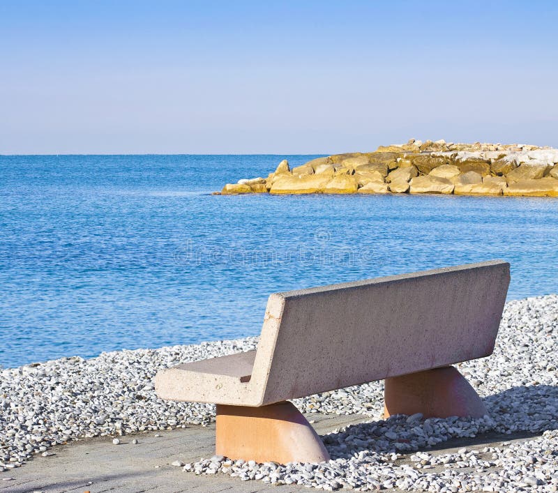Concrete Bench by the Sea with Calm Water Stock Photo - Image of ...