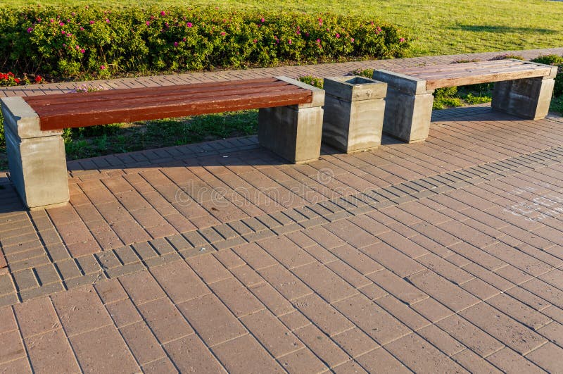 A Concrete Bench Stands in the Park Stock Photo - Image of path, seat ...