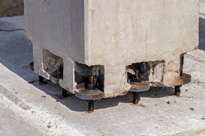 A Concrete Block with Bolts and Nuts on it Stock Photo - Image of blue ...