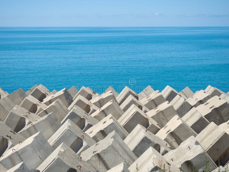 Concrete Breakwaters and Heaps of Stones on the Shore. Shore Protection ...