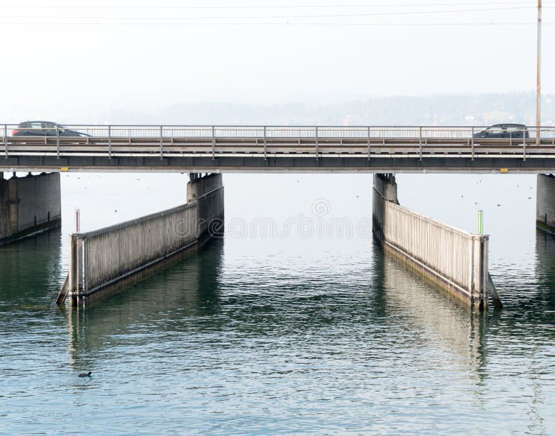 Concrete Bridge Over Water with a Train Line and Road Running Parallel ...