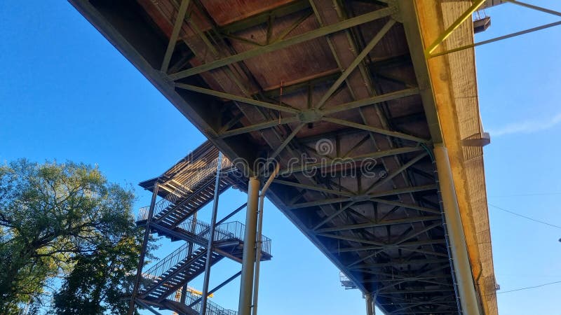 Concrete Bridge Structure Against a Blue Sky, View from Below and Metal ...
