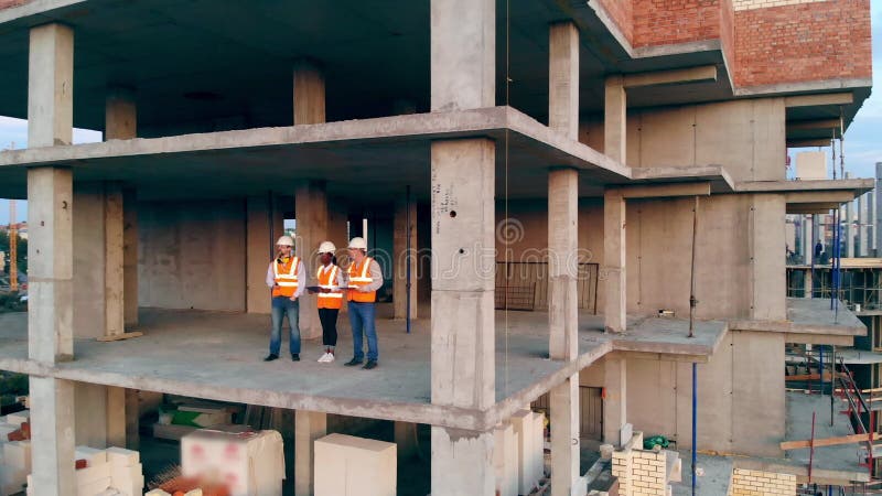 Concrete Building in Progress with a Team of Engineers Stock Video ...
