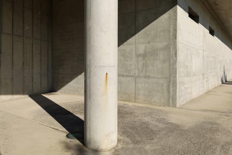 Concrete Column on Cement Sidewalk with Solid Reinforced Concrete Wall ...