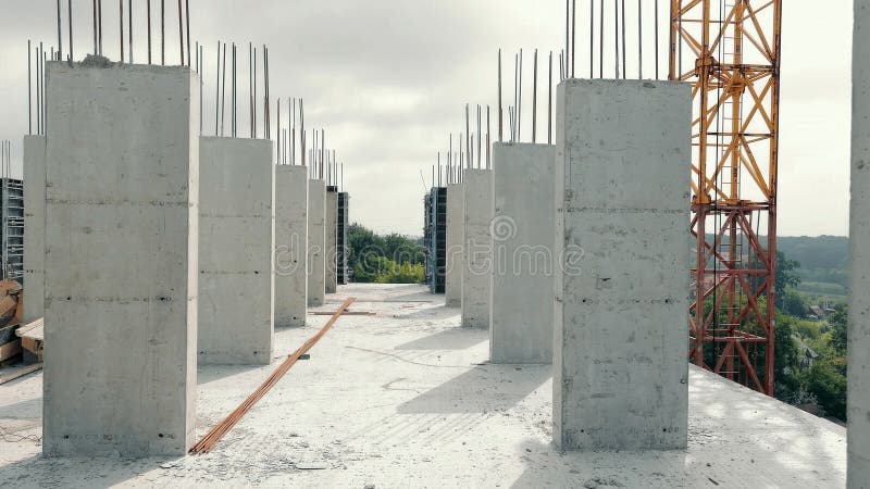 Concrete Columns in a Building Under Construction. Rows of Tall ...