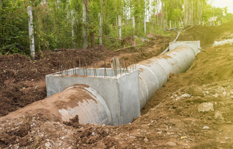 Concrete Culvert Drainage Water Row on a Construction Site .Concrete ...