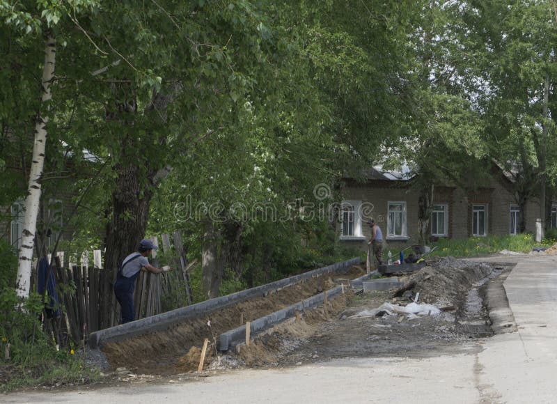 Concrete Curb Installation. String Line Level Guide is Stretched ...