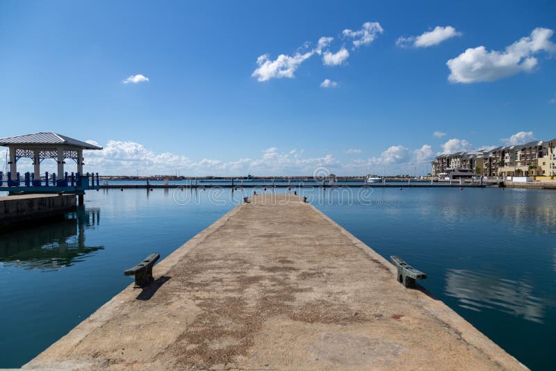 Concrete Dock Over the Lake Under Blue Cloudy Sky Background Stock ...