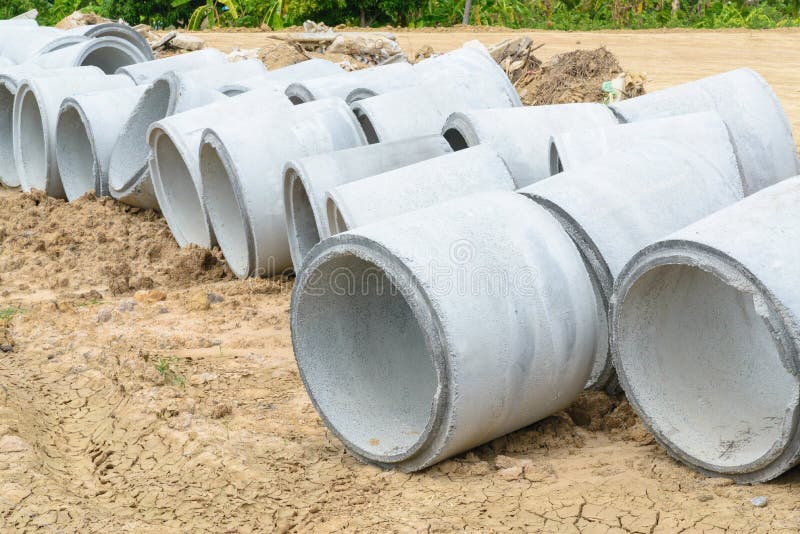Concrete Drainage Pipes Stacked for Construction, Irrigation, in Stock ...