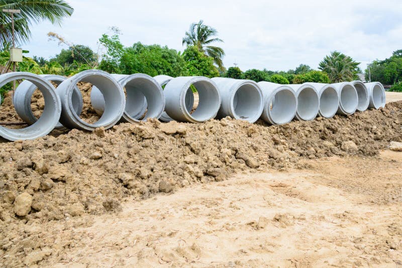 Concrete Drainage Pipes Stacked for Construction, Irrigation, in Stock ...