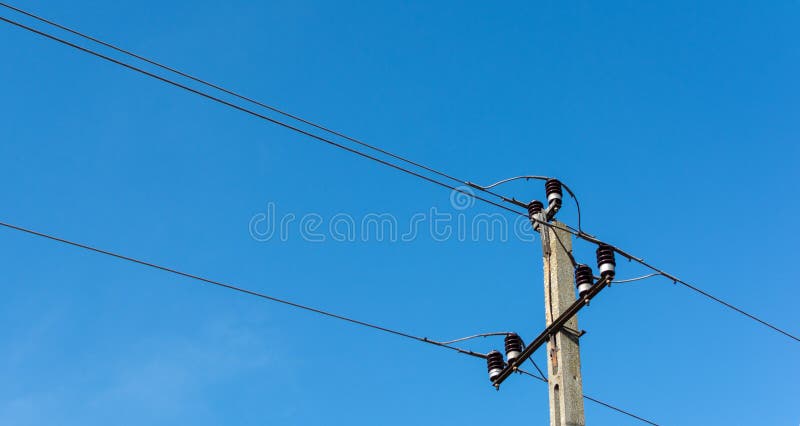 Concrete Electric Pylon or Post with Electric Wires Against Clear Blue ...