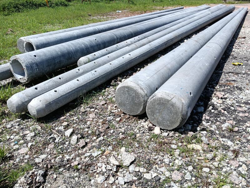 Concrete Electricity Pole Stacked on the Ground Ready for Installation ...