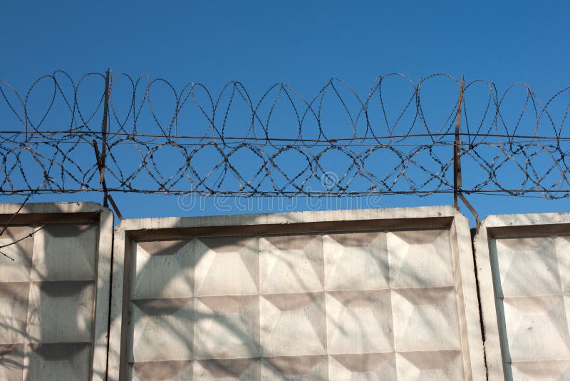 Concrete Fence with Barbed Wire Stock Photo - Image of freedom ...