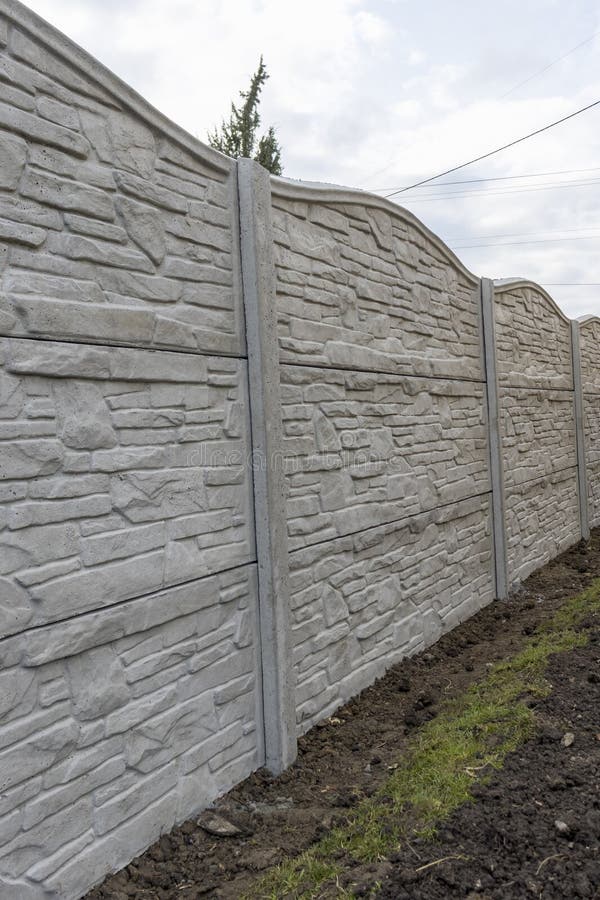 Concrete Fence from Panels. Decorative Fence with a Gray Panel Fence in ...