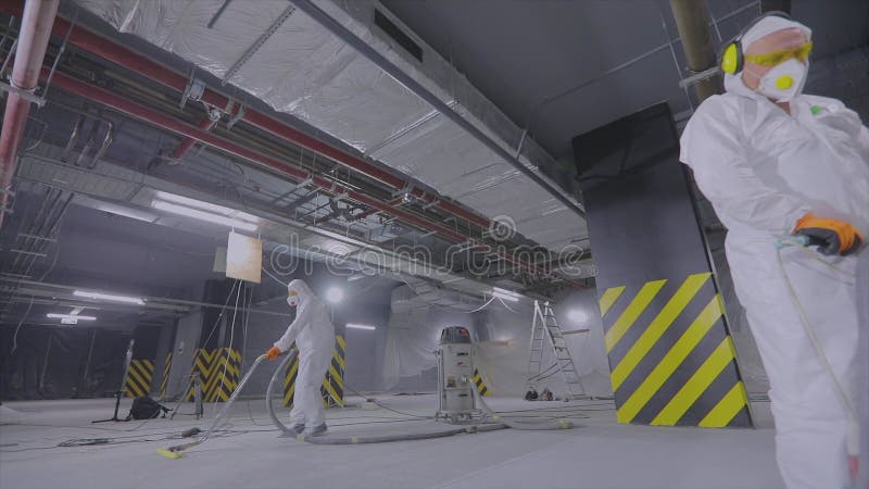 Concrete Floor Processing during Construction. Grinding a Concrete ...