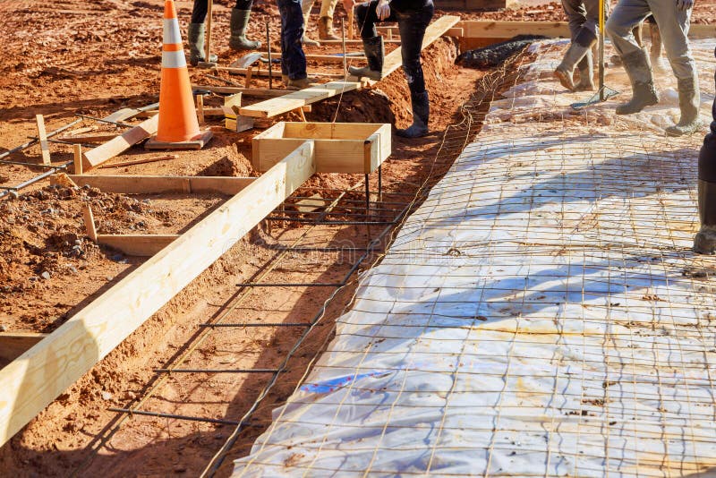 Concrete Foundation Preparation. Crew Sets Rebar Mesh for Sidewalk ...
