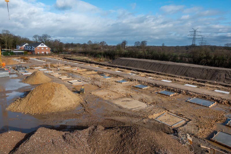 Concrete Foundations for the Columns of a Factory Building are Poured ...