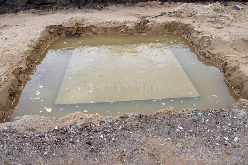 Concrete Foundations for the Columns of a Factory Building are Poured ...