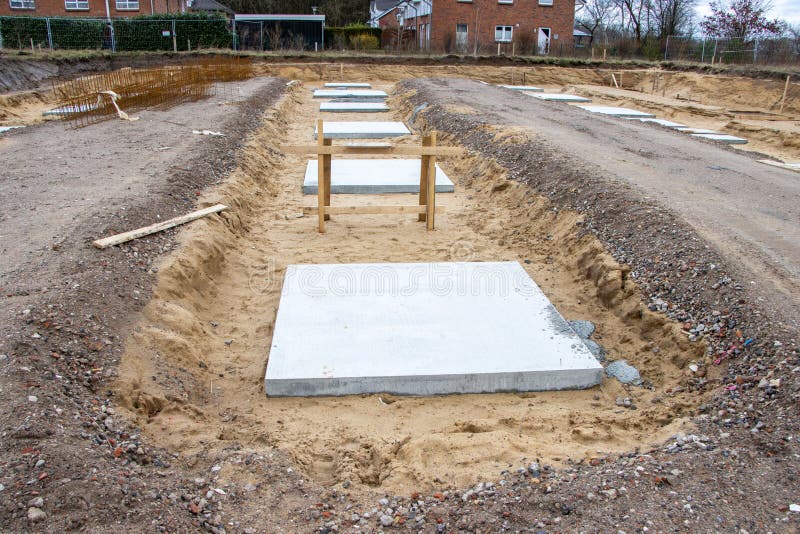Concrete Foundations for the Columns of a Factory Building are Poured ...