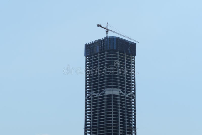 Concrete Frame of a High-rise Building with a Crane at the Top Stock ...
