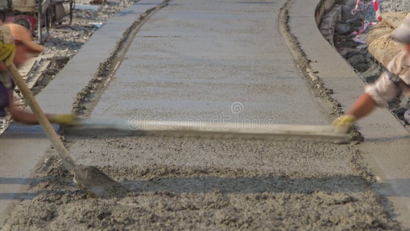 Concrete Leveling Workers on Construction Site with a Mix Trowel ...