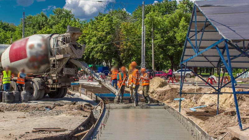 Concrete Leveling Workers on Construction Site with a Mix Trowel ...