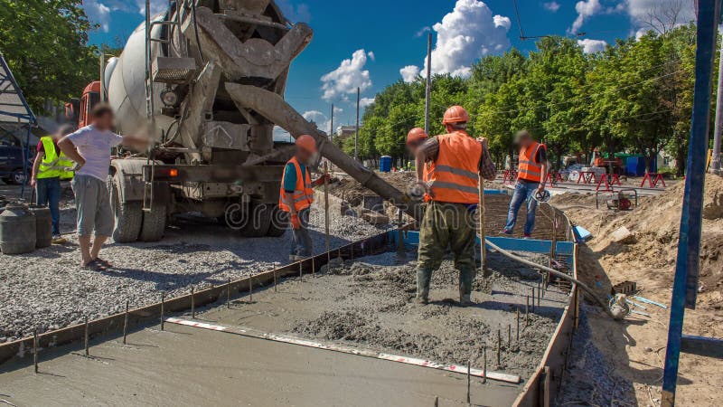 Concrete Leveling Workers on Construction Site with a Mix Trowel ...