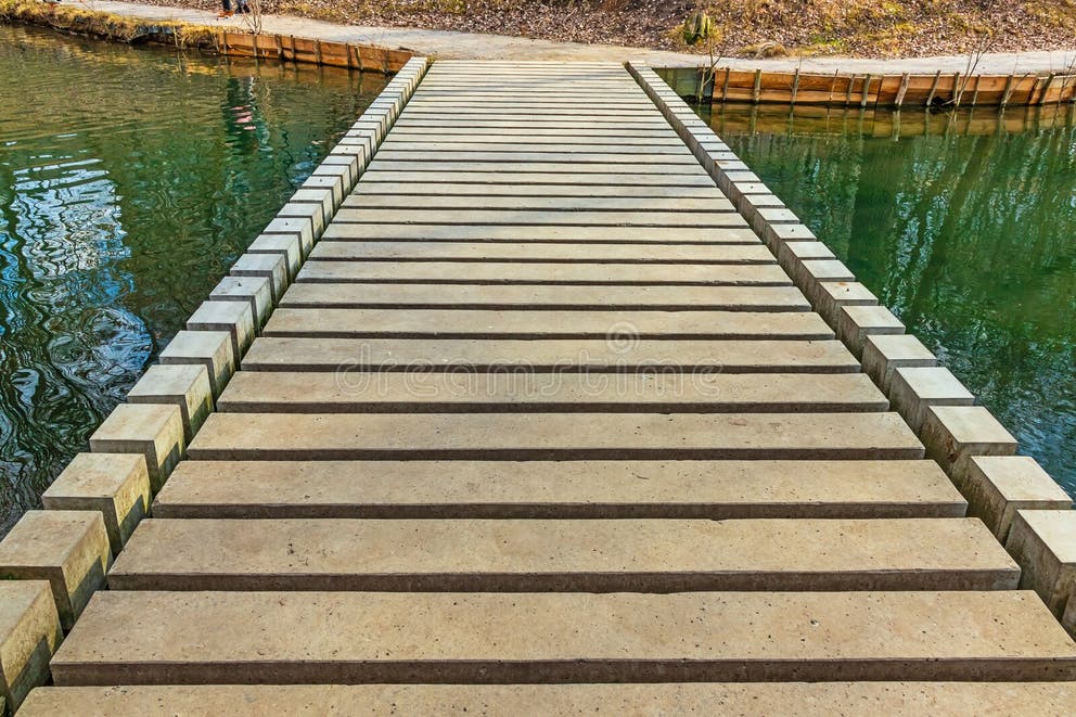 Concrete Low Footbridge on a Stream or River. Construction of a Modern ...
