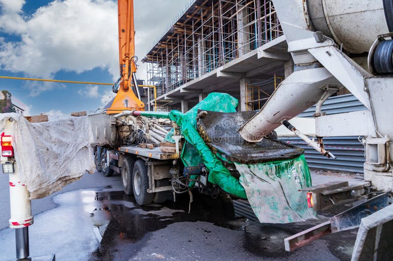 The Concrete Mixer Transports Concrete To the Concrete Pump Operator at ...