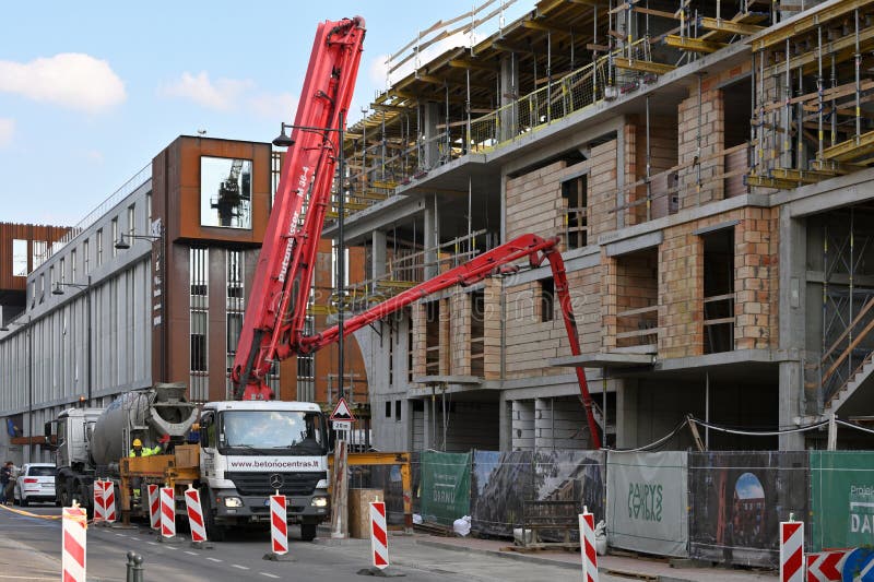 Concrete Mixer Truck and a Concrete Pump on the Construction Site ...