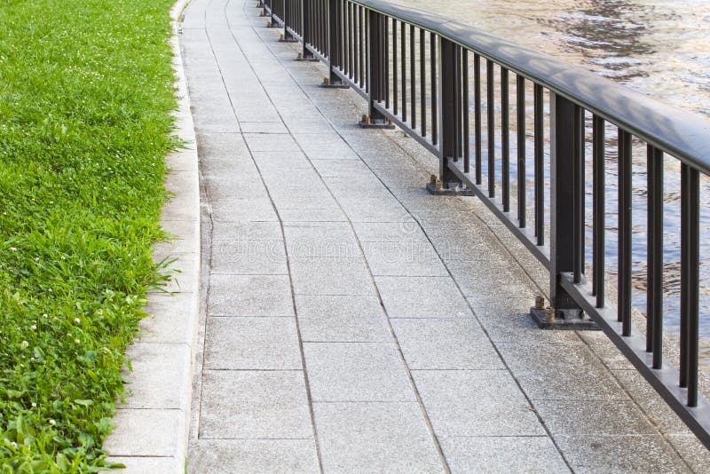 Concrete Pathway and Metal Fence Stock Photo - Image of outdoor ...
