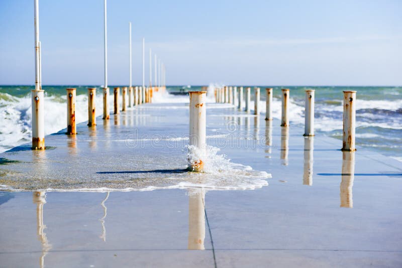 Concrete Pier with Rusty White Bars on the Sea Side. Stock Image ...