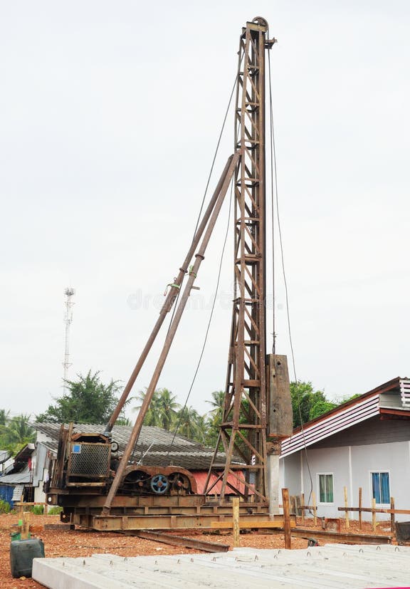 Concrete Pile is Being Driven into the Ground at Construction Site ...
