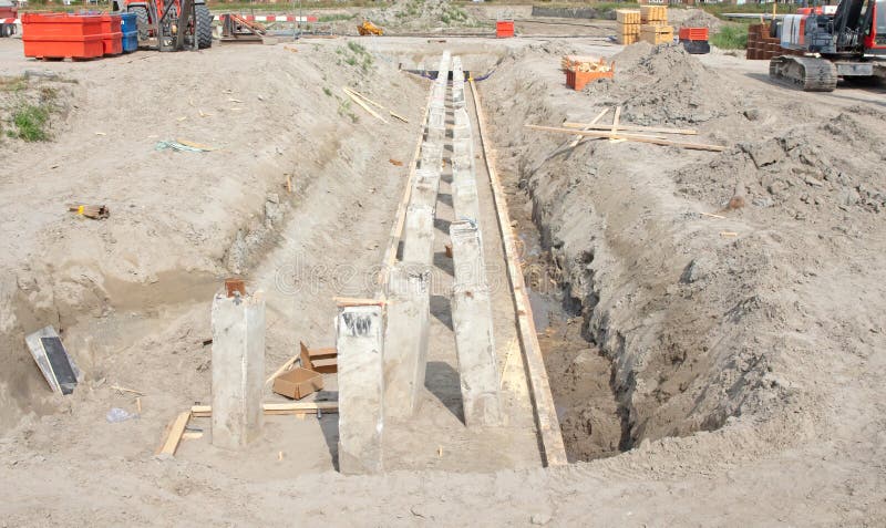 Concrete Piles Foundation for a New Building on Construction Site Stock ...