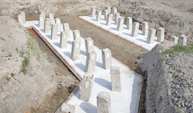 Concrete Piles Foundation for a New Building on Construction Site Stock ...