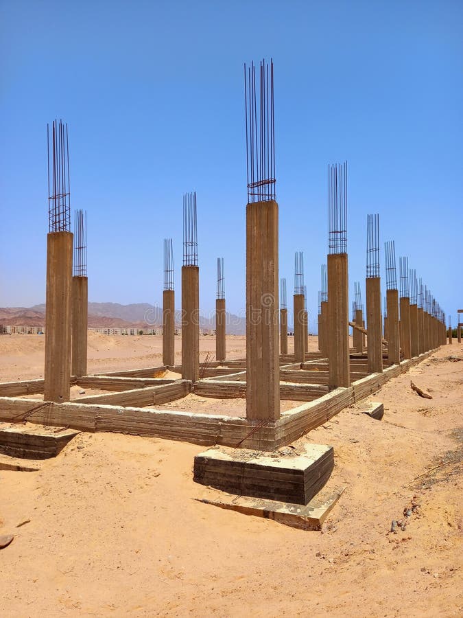 Concrete Pillars in the Desert Under Blue Sky. Building Foundations in ...