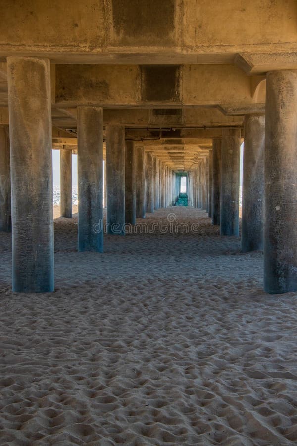 Concrete Pillars Underneath a Long Pier on the Beach Stock Photo ...