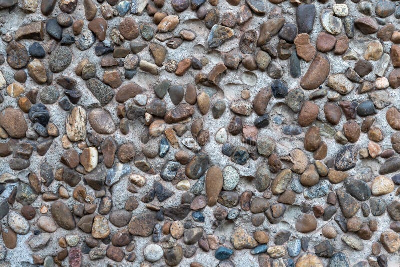 Concrete Plaster Interspersed with Many Smooth River Stones. Decorative ...