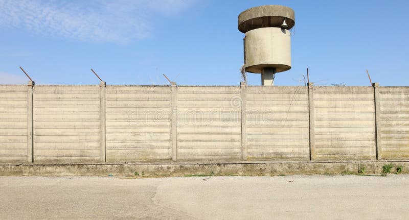 Concrete Precast Compound Wall with Cement Watchtower on Behind. Road ...