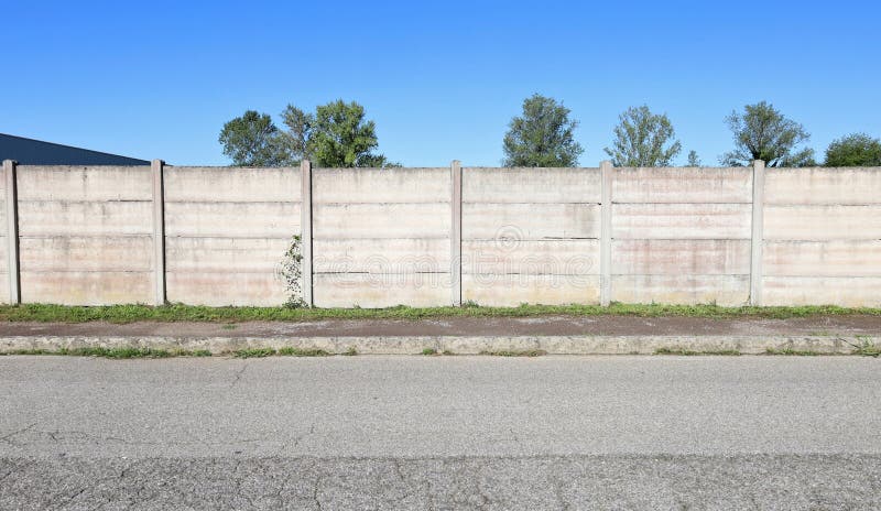 Concrete Precast Compound Wall at the Road Side. Sidewalk and Road in ...