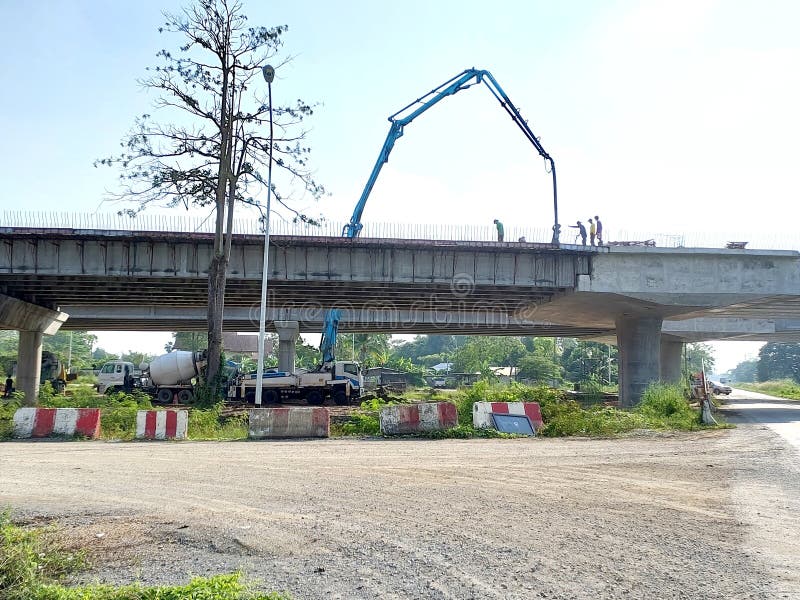 Concrete Pump Truck with Worker Working on Elevated Road Construction ...
