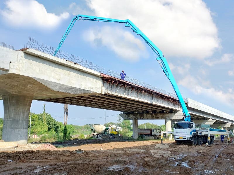 Concrete Pump Truck with Worker Working on Elevated Road Construction ...