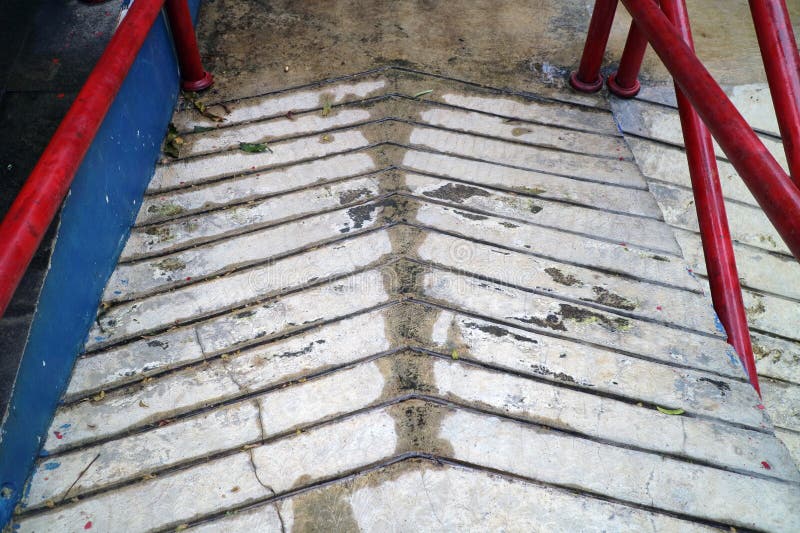 Concrete Ramp with Red Railings for Accessibility Stock Photo - Image ...